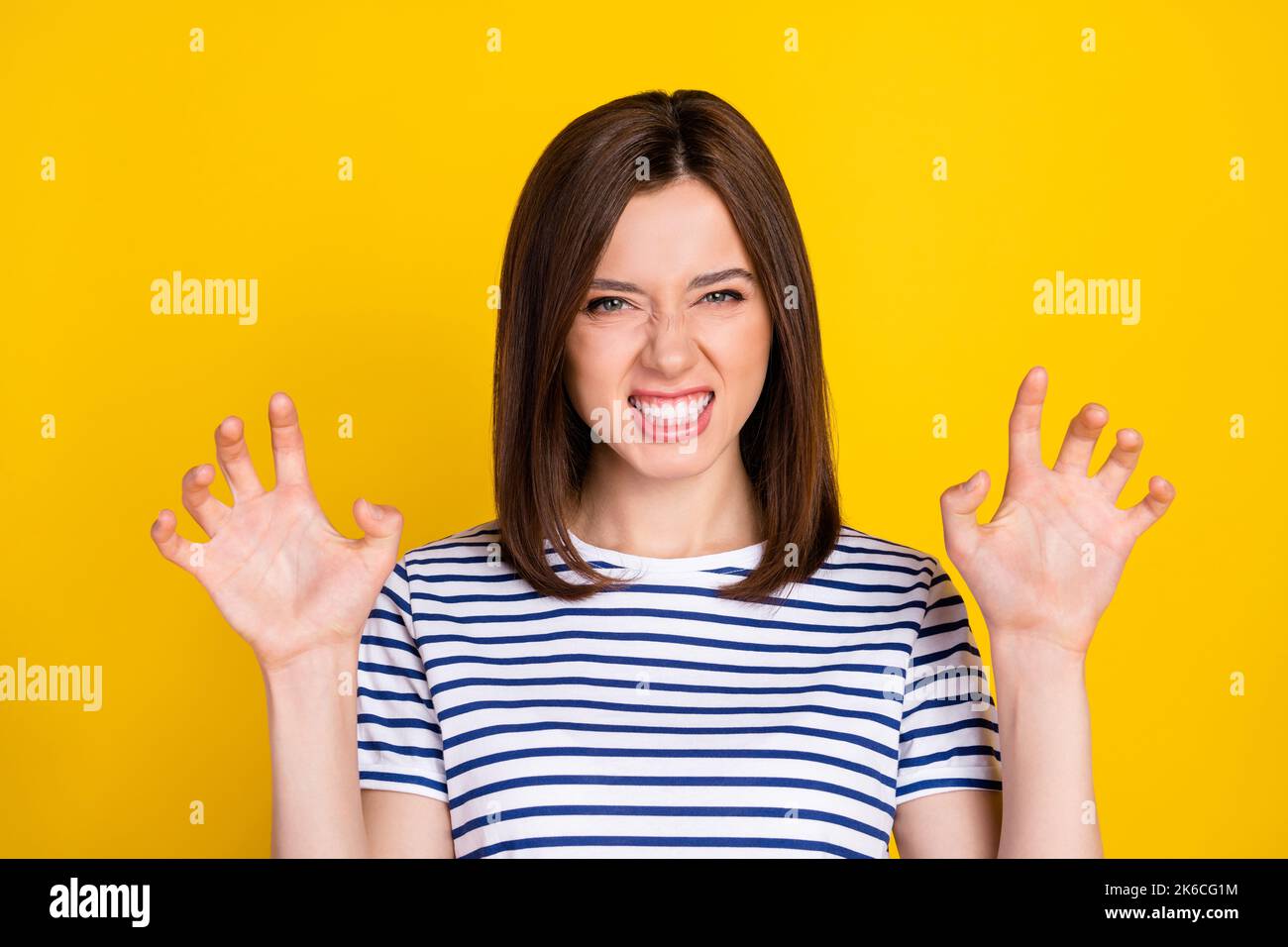 Photo of young funny angry evil girl showing claws hands attack ...
