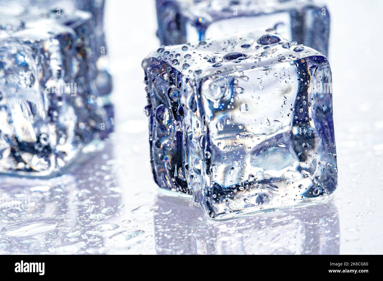 ice cubes on blue background Stock Photo - Alamy