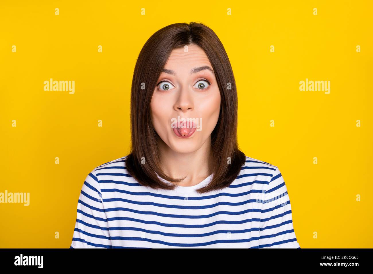 Photo portrait of pretty young lady smiling tongue out foolish naughty ...