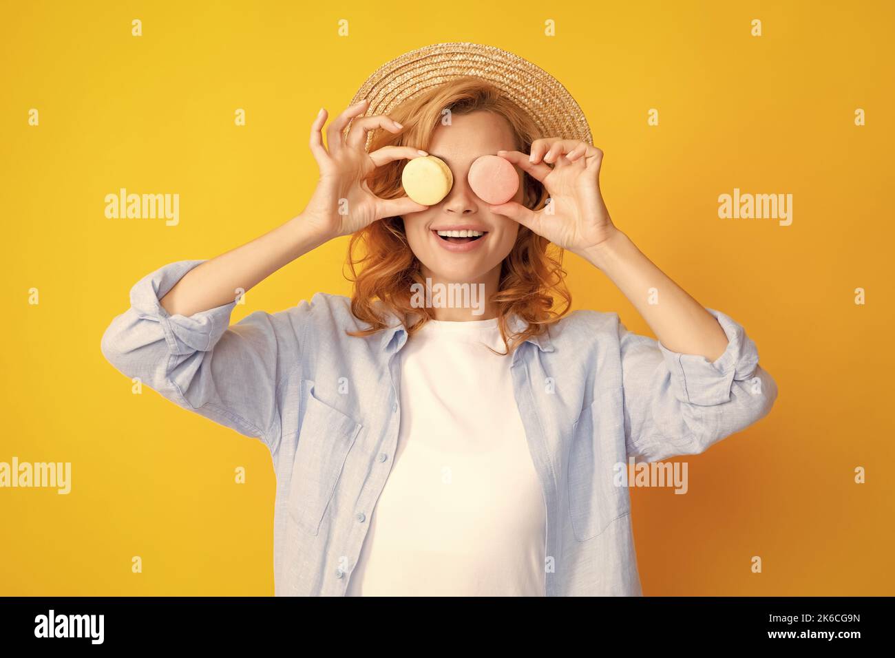 Funny woman hold two cake in front of eyes. Hipster girl. Charming ...