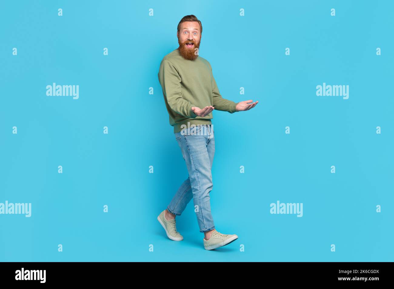 Full size photo of handsome young guy carry hold empty space invisible ...