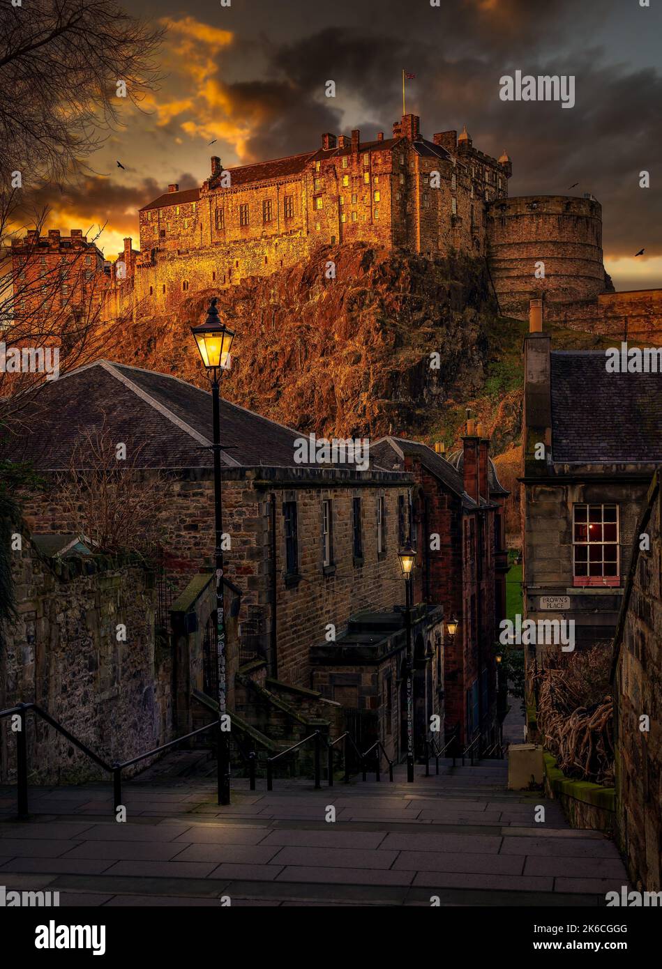 A vertical shot of Vennel Steps and the Castle of Edinburgh in Scotland ...