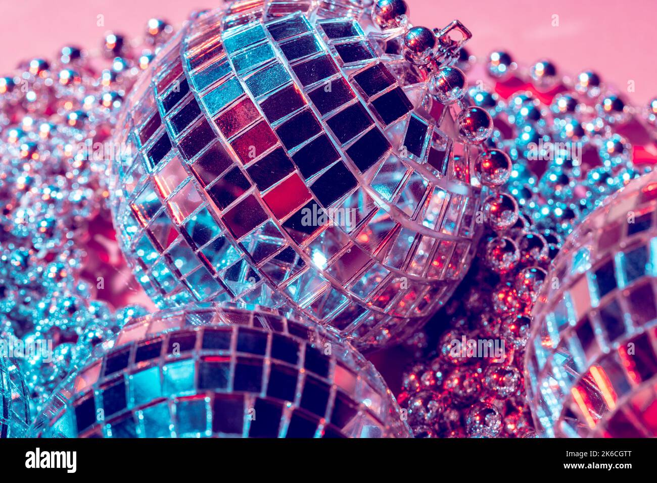 disco balls for decorationof a party on pink background Stock Photo - Alamy