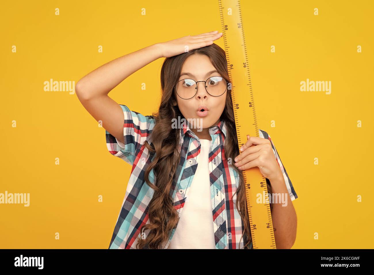 Kid height measure, growth measurement. Shocked surprised teenager ...