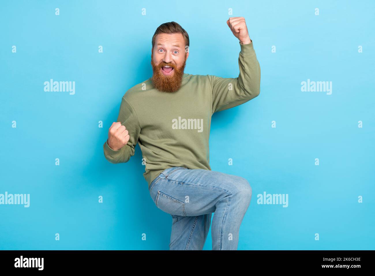 Portrait of good mood guy with ginger hairdo wear khaki pullover ...