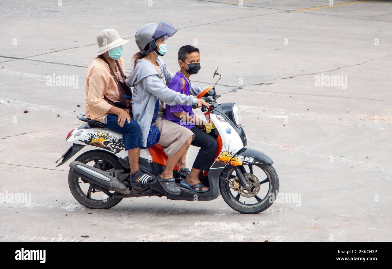 SAMUT PRAKAN, THAILAND, OCT 03 2022, A pair of women ride a motorcycle ...
