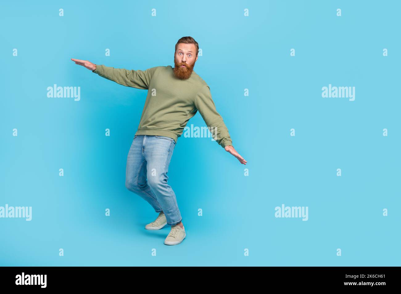 Full size photo of nice young guy try keep balance falling leaning ...