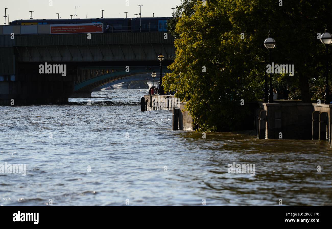 A view down The River Thames looking through Blackfriars railway bridge ...