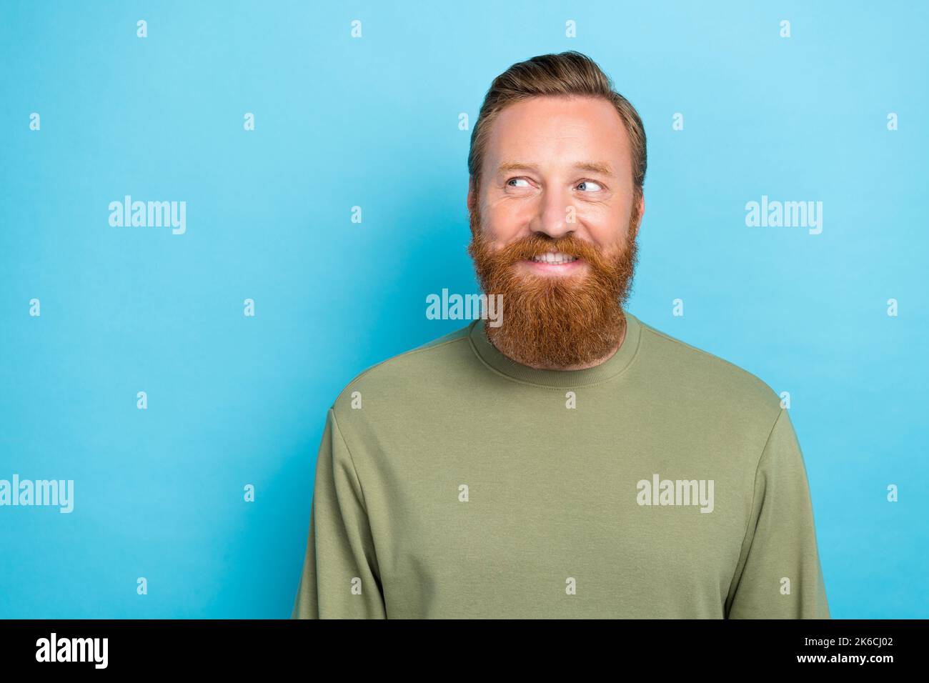 Portrait of funny optimistic cheerful guy with red hairdo dressed khaki ...