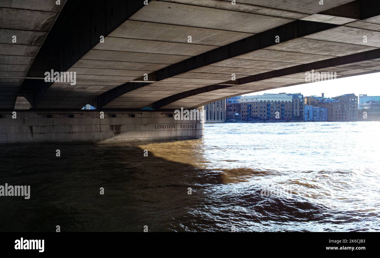 A wide angle shot of the underneath of London Bridge showing column ...