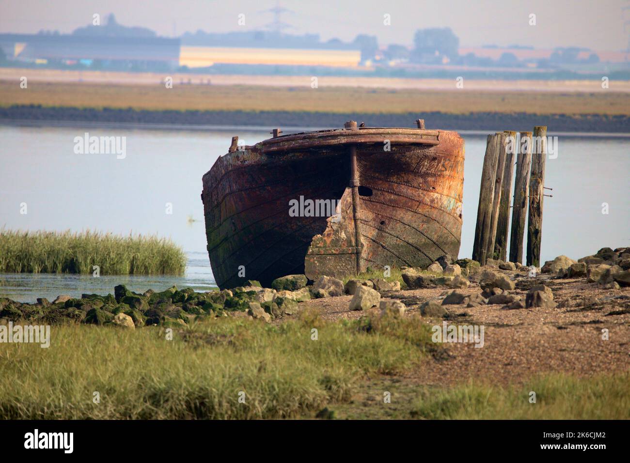 Side view of rusting abandoned boat wrecks at Riverside country park Stock Photo - Alamy