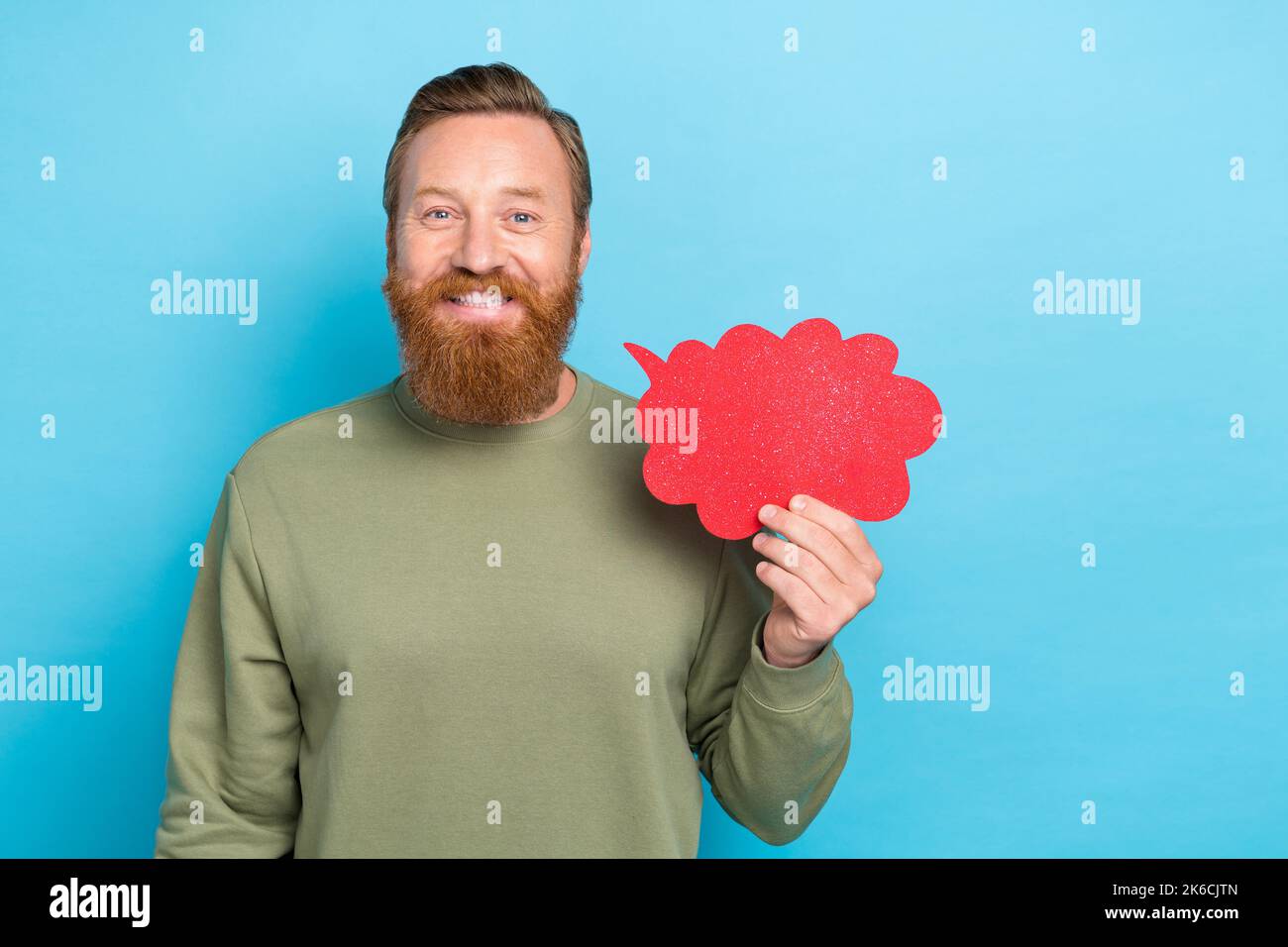 Photo portrait of attractive young guy holding comics speech bubble ...