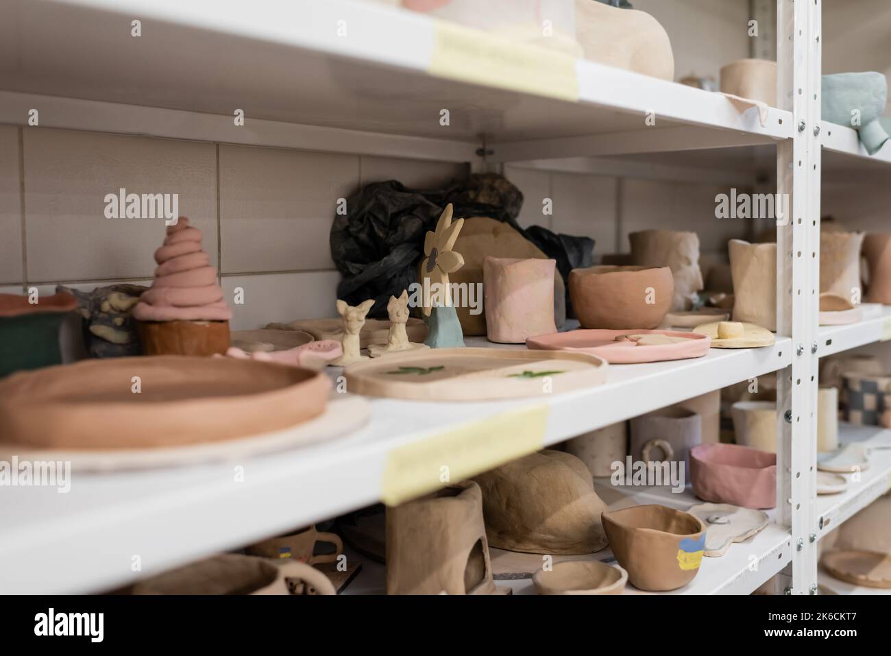 different clay sculptures on shelves of pottery shop,stock image Stock ...