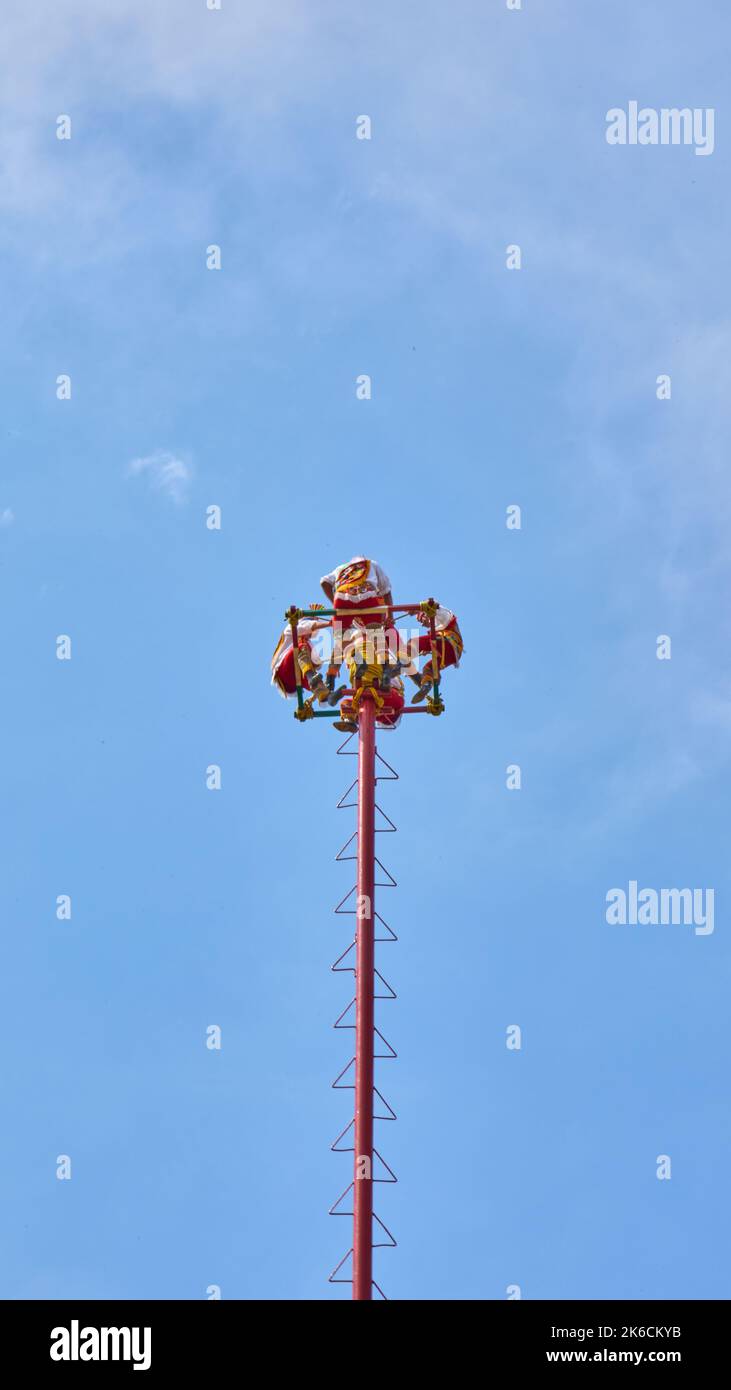 A vertical shot of dancers on top of a pole starting to perform ...