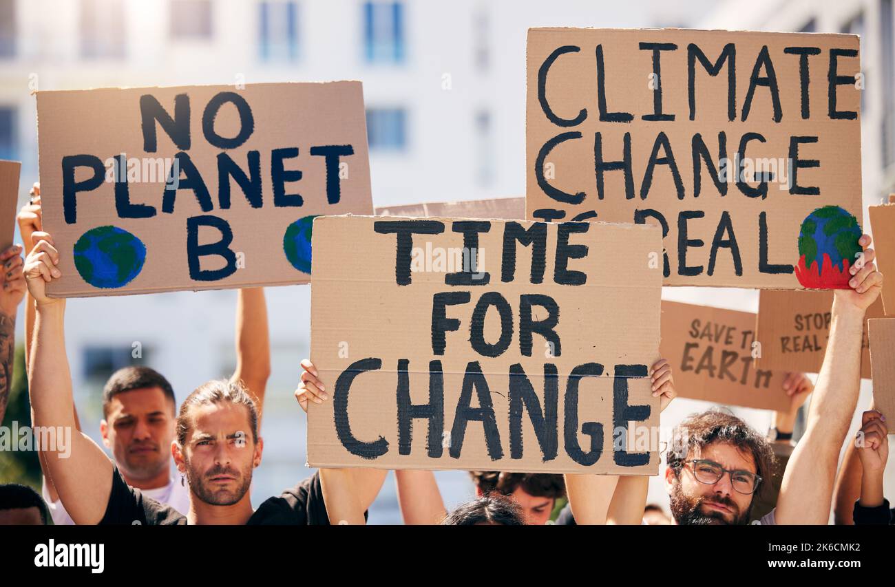 Group walking people holding signs hi-res stock photography and images ...