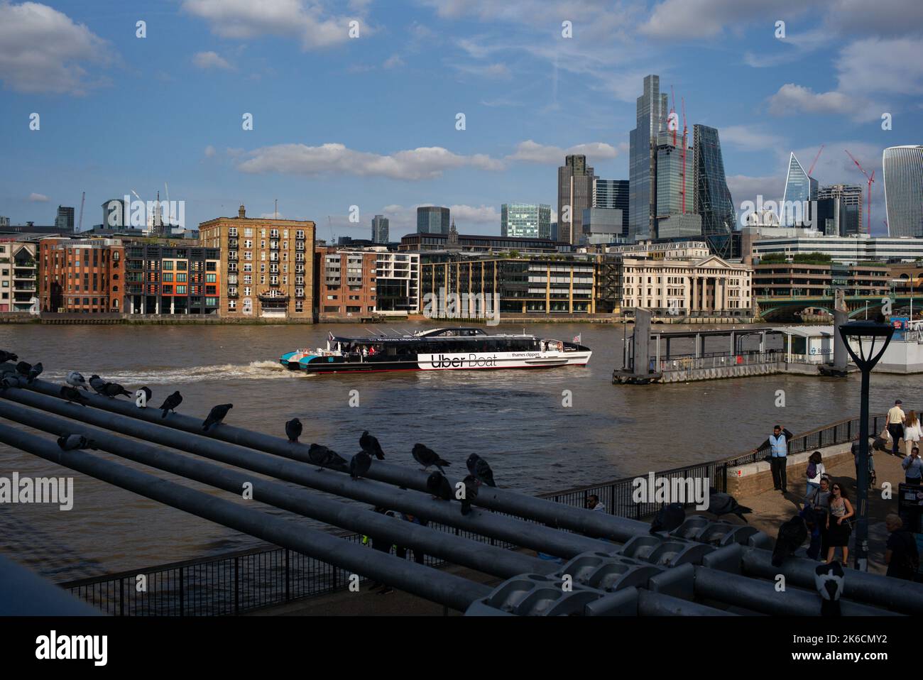 The Jupiter Clipper Thames clipper boat passes Millennium bridge ...