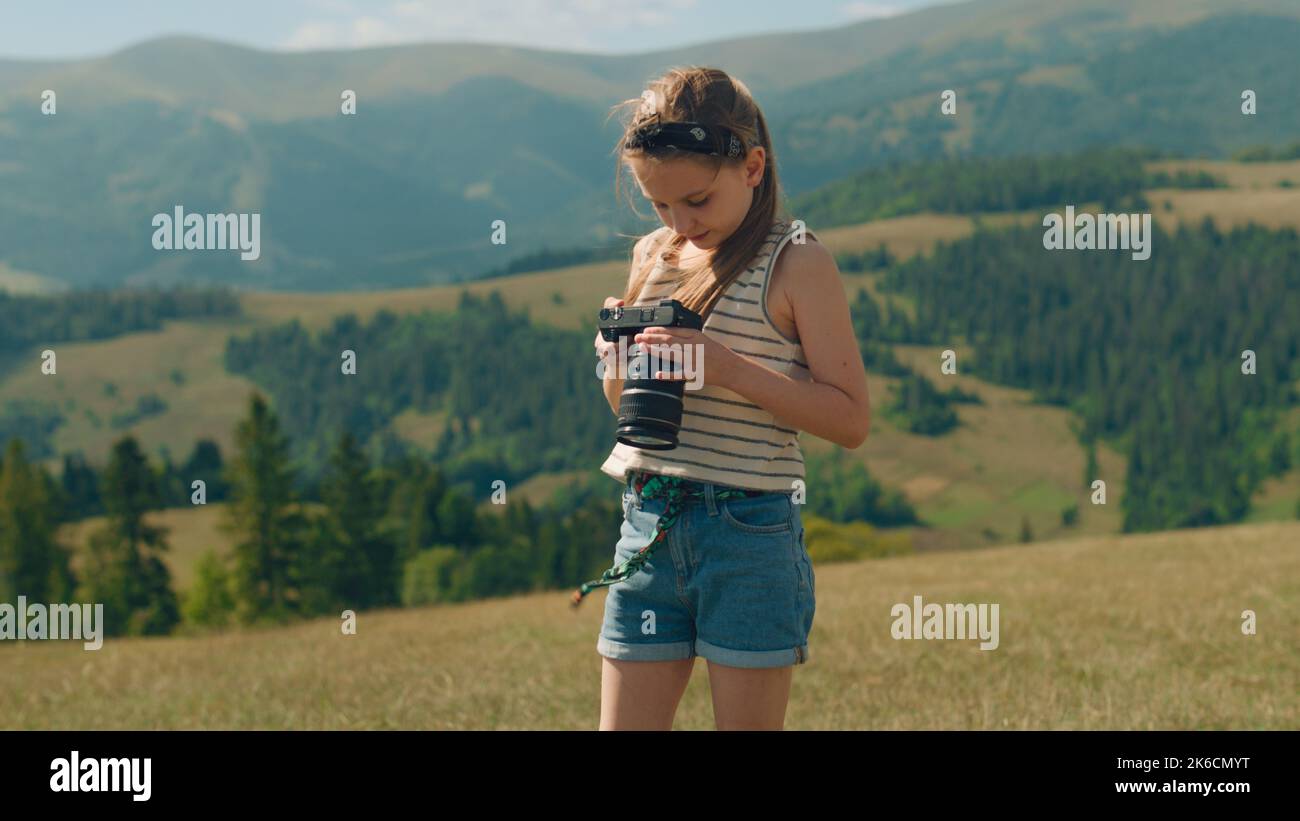 Young photographer filming beautiful movie. Girl creating content in ...