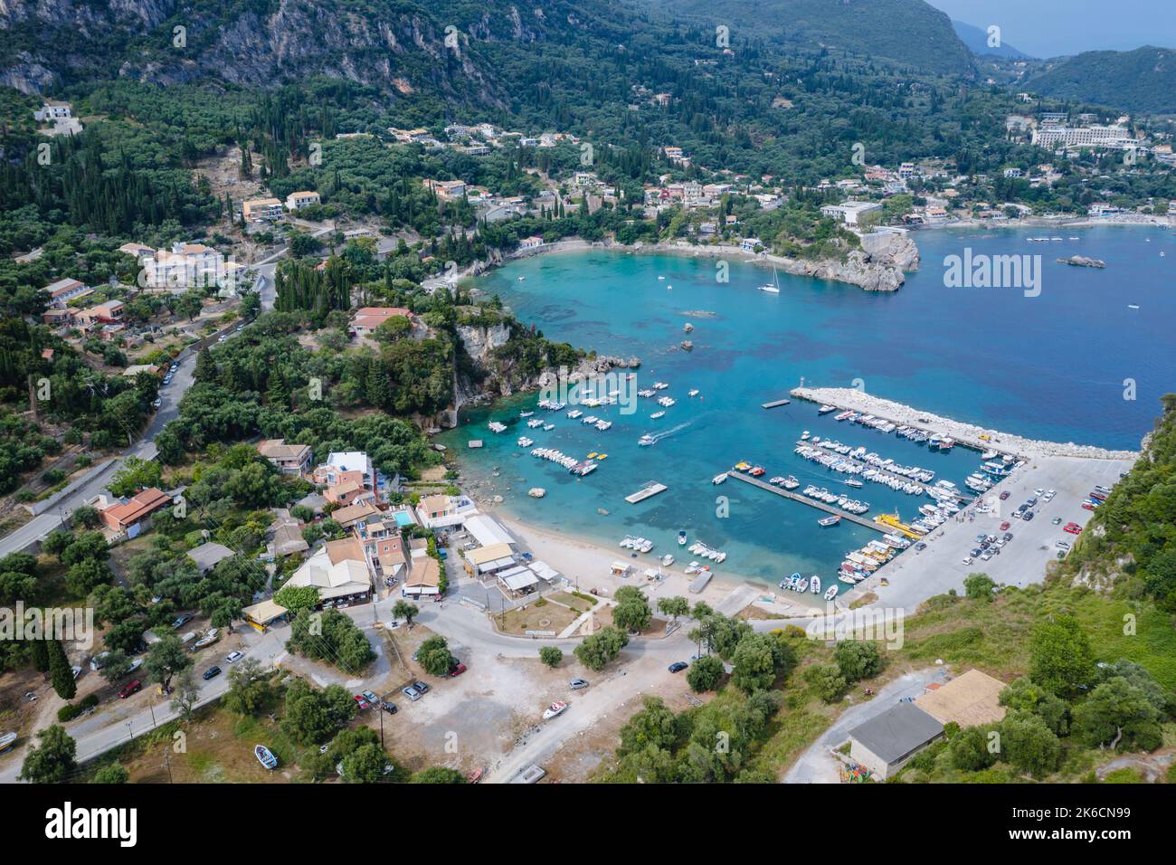 Hearth shaped bay in Palaiokastritsa famous resort town on Greek Island ...