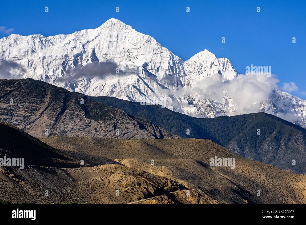 The white snowy Nilgiri Mountain Peak seen from Kagbeni Village in ...