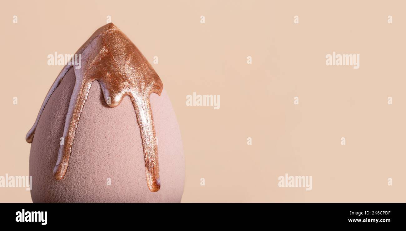 Closeup photography of beauty blender with dripping bronzer on it ...
