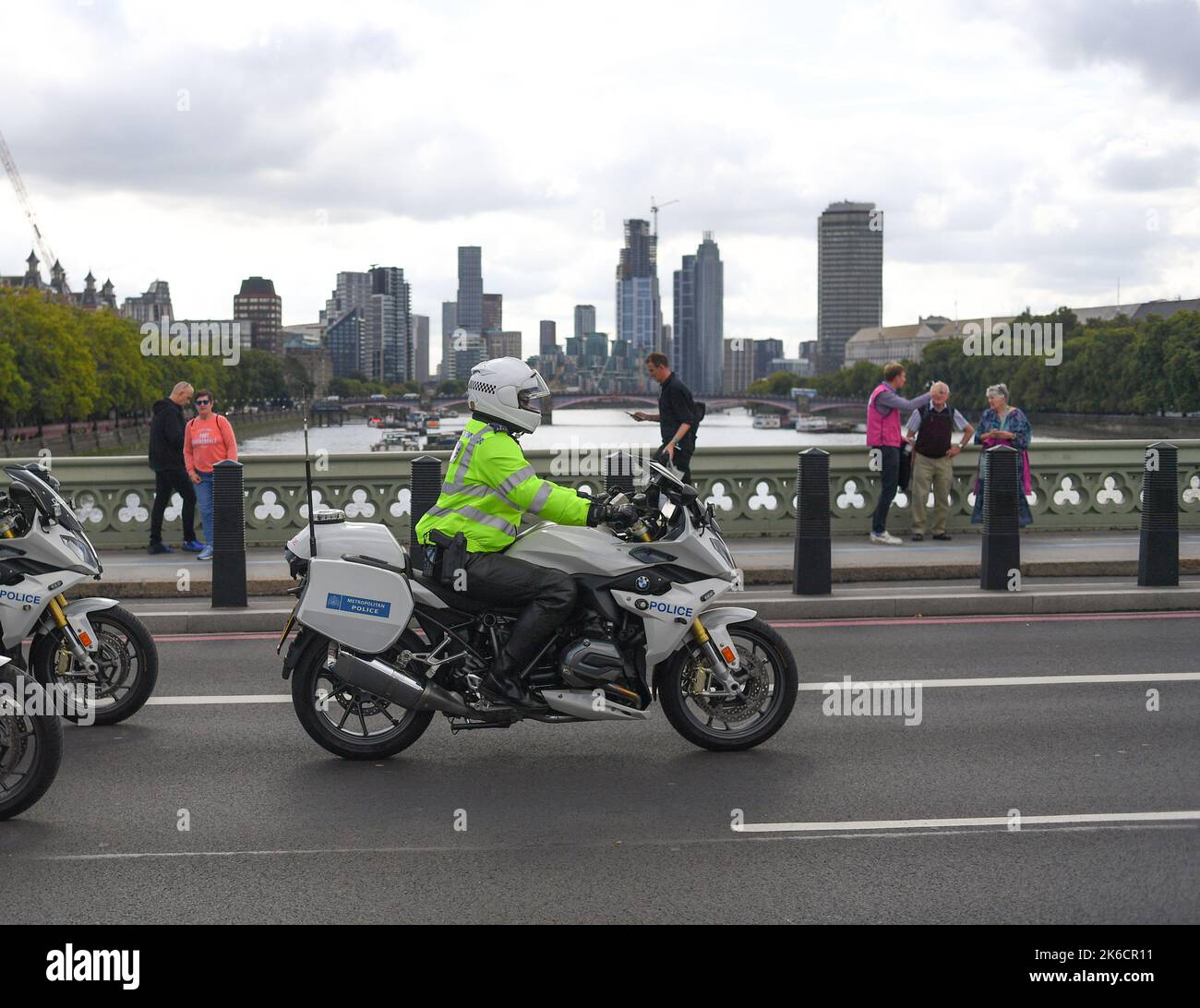 Armed metropolitan London Police on Motorbikes cross Westminster Bridge ...