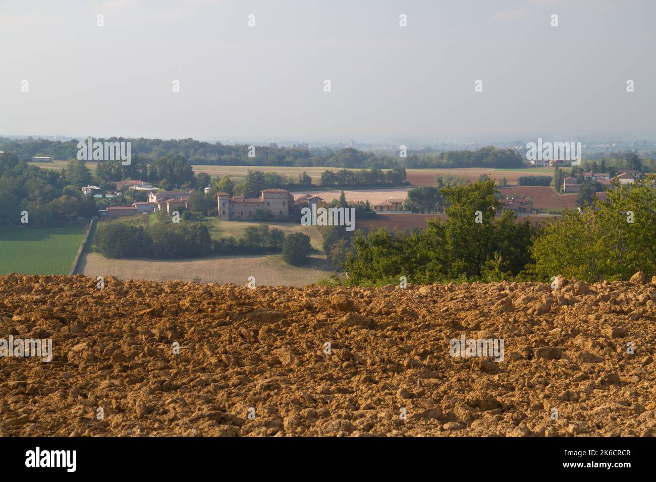 Reddish brown, dusty, clayey soil, Terra Rossa, in a hilly landscape ...