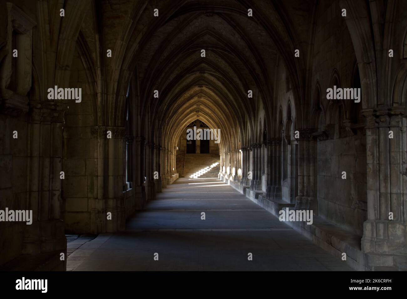 Dark gallery of a monastery Stock Photo - Alamy