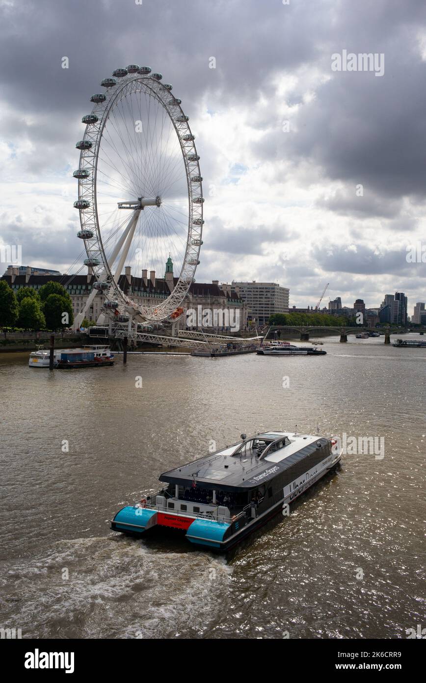 Jupiter Clipper by Thames Clippers Uber Boat passes by The London Eye ...