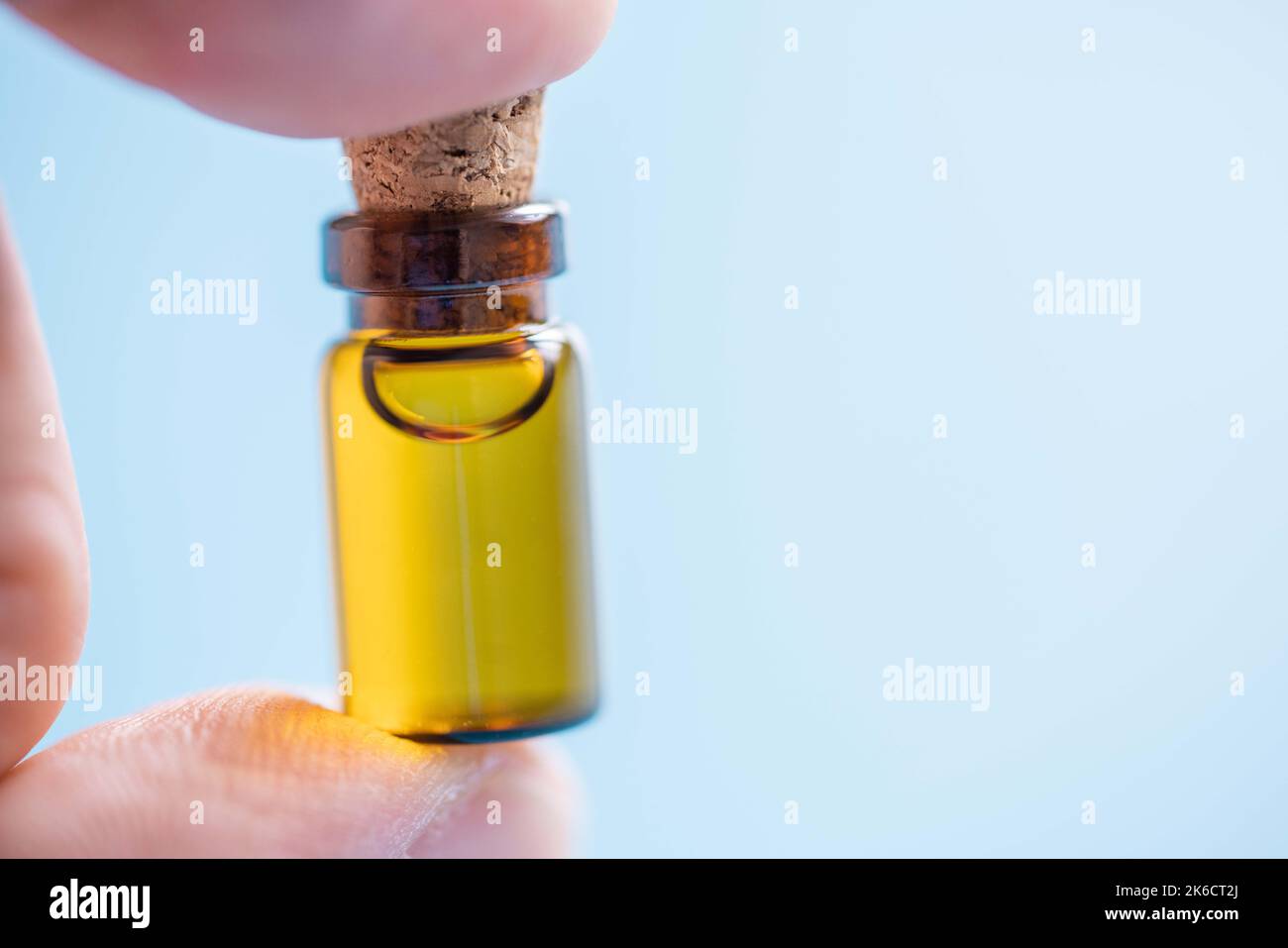 Small vial with a stopper of poison Stock Photo - Alamy
