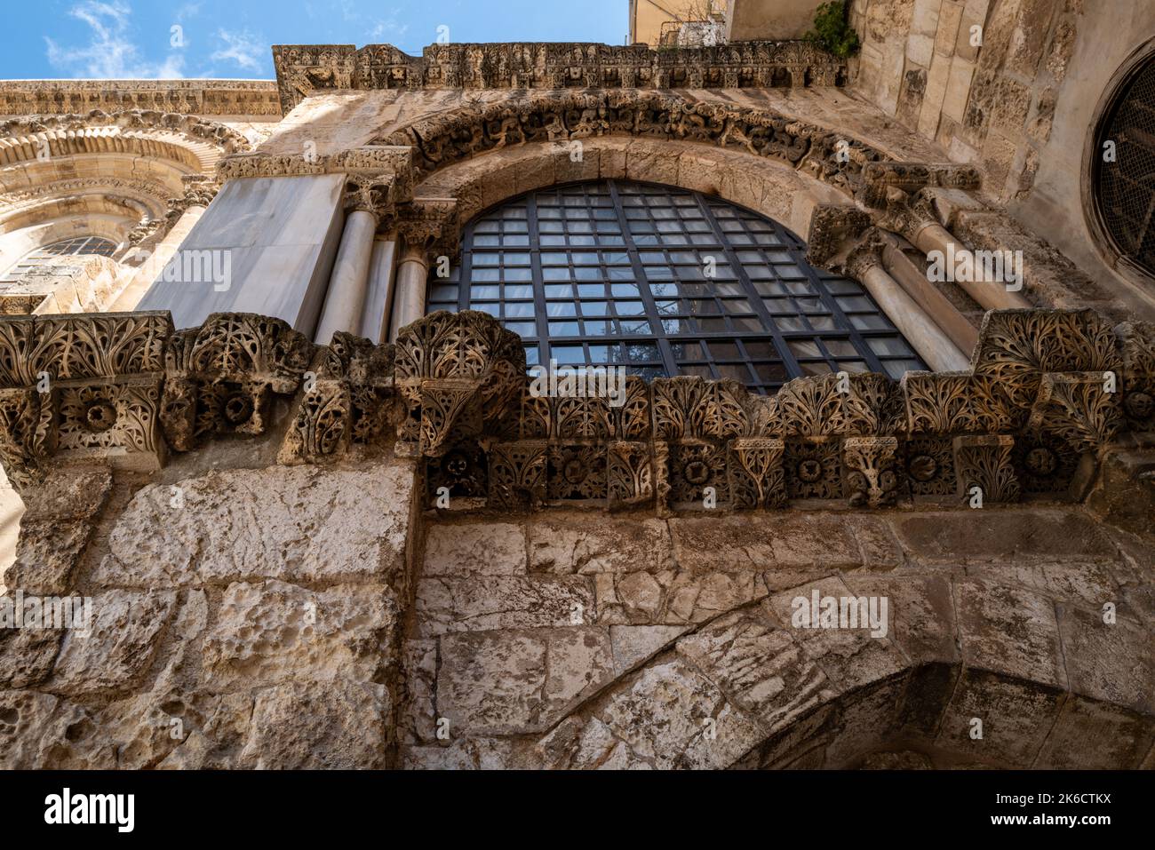 A low-angle view of a church of the Holy Sepulchre inside the old city ...