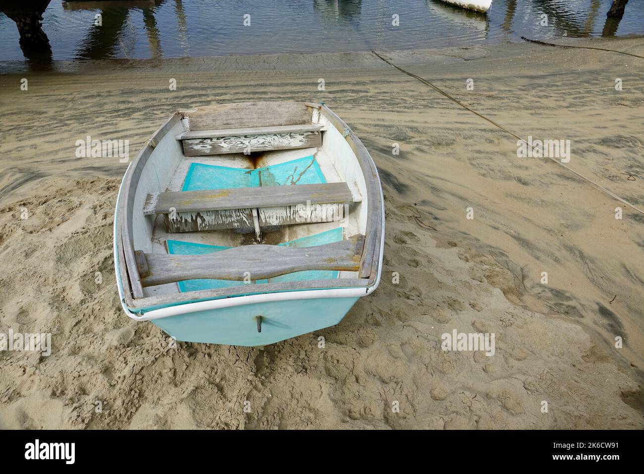 tiny wood rowboat beached on the sand Stock Photo - Alamy