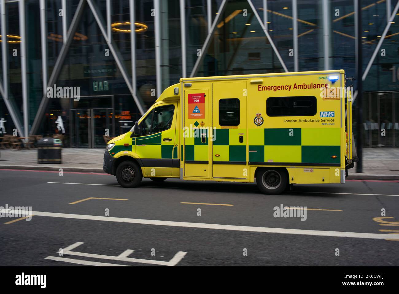 A London Ambulance trust vehicle travels down Victoria street London UK ...