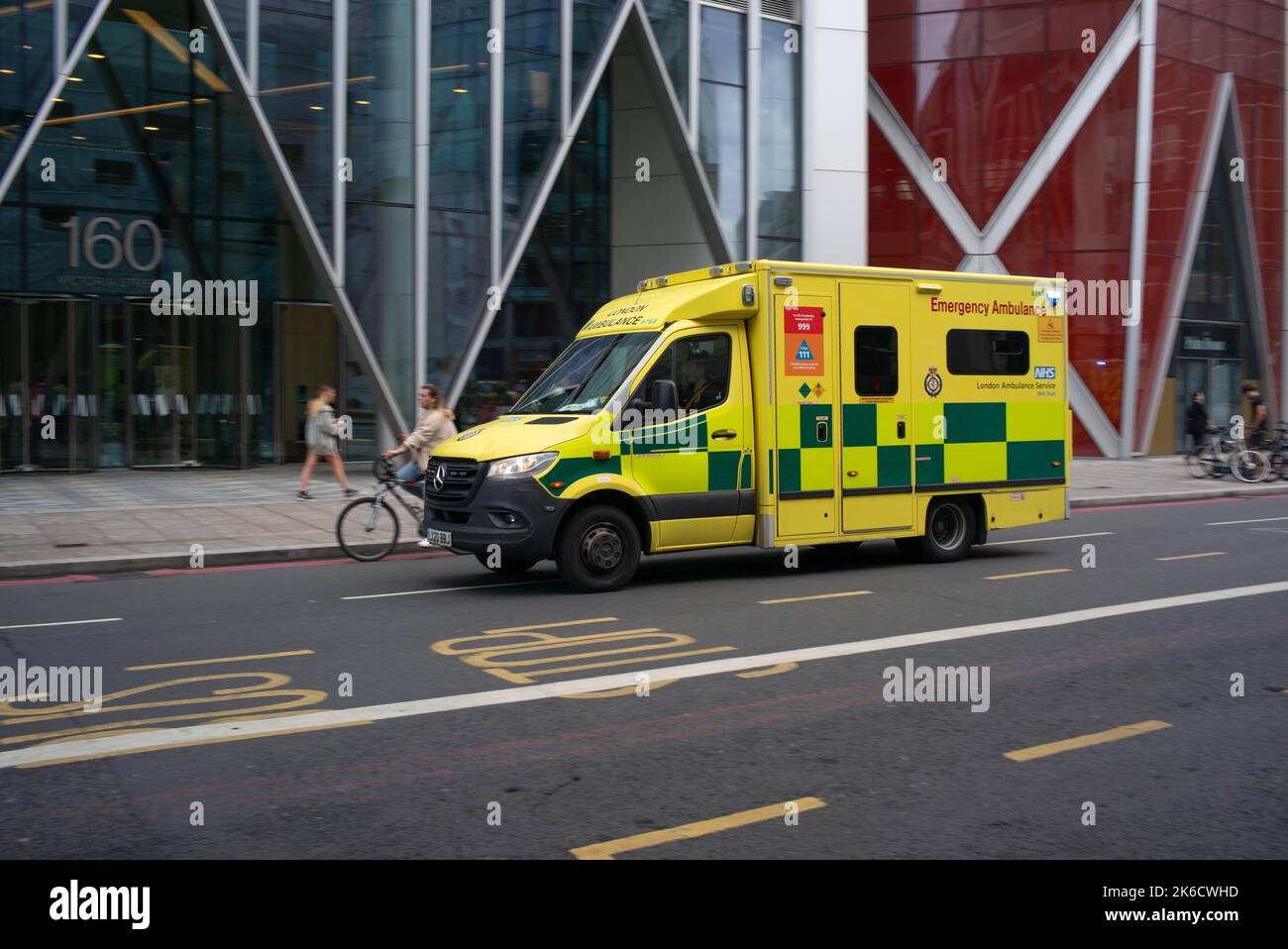 A London Ambulance trust vehicle travels down Victoria street London UK ...