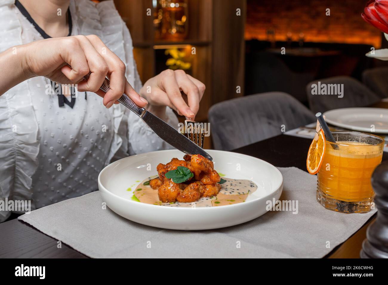 Woman cutting meat dinner hi-res stock photography and images - Alamy