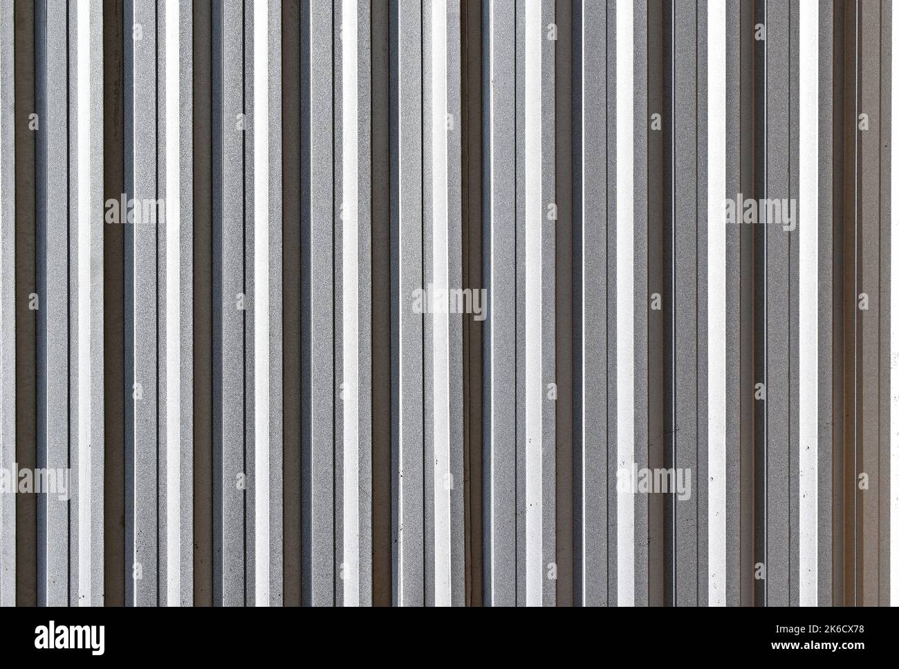 Gray corrugated metal plate surrounding wasteland Stock Photo - Alamy