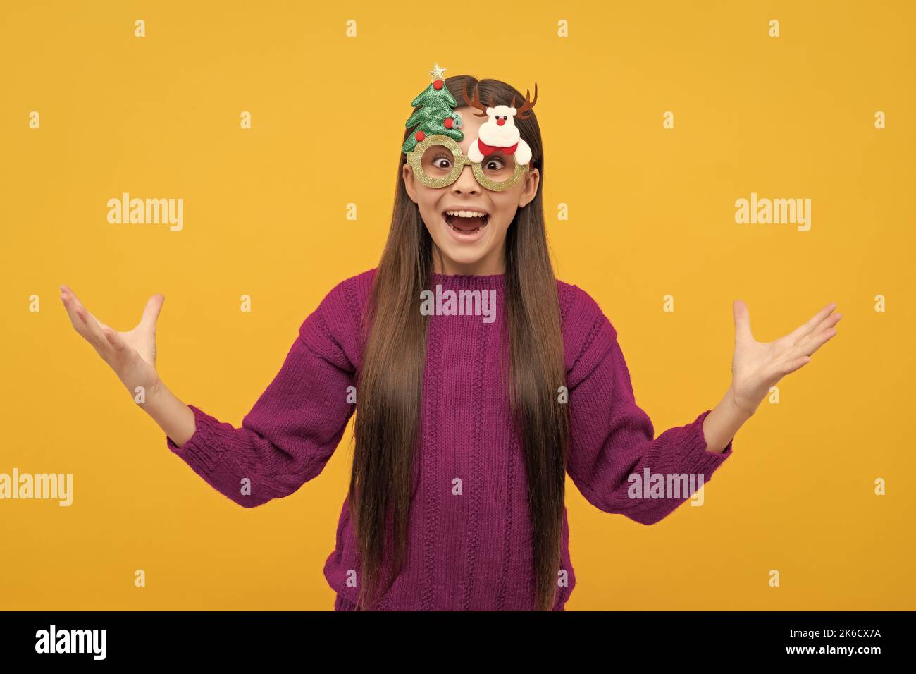 amazed kid in party glasses on yellow background, christmas Stock Photo ...