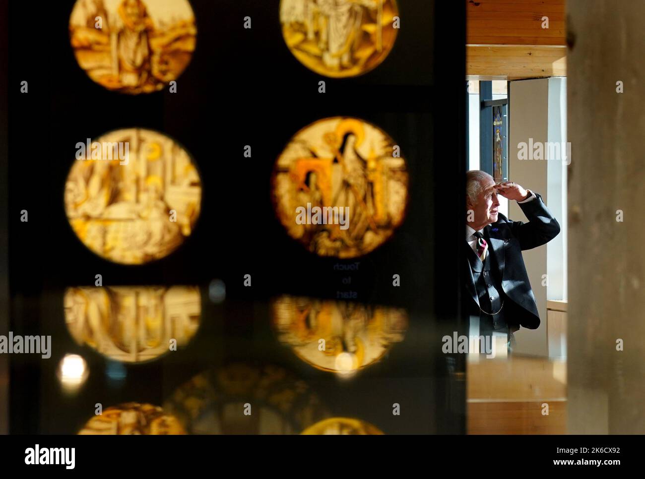 King Charles III views stain glass windows during a visit to the ...