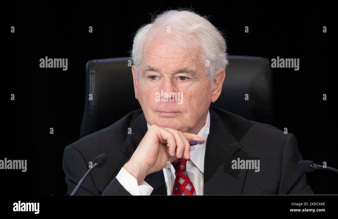 Commissioner Paul Rouleau watches a lawyer appear via video conference during the first day of ...