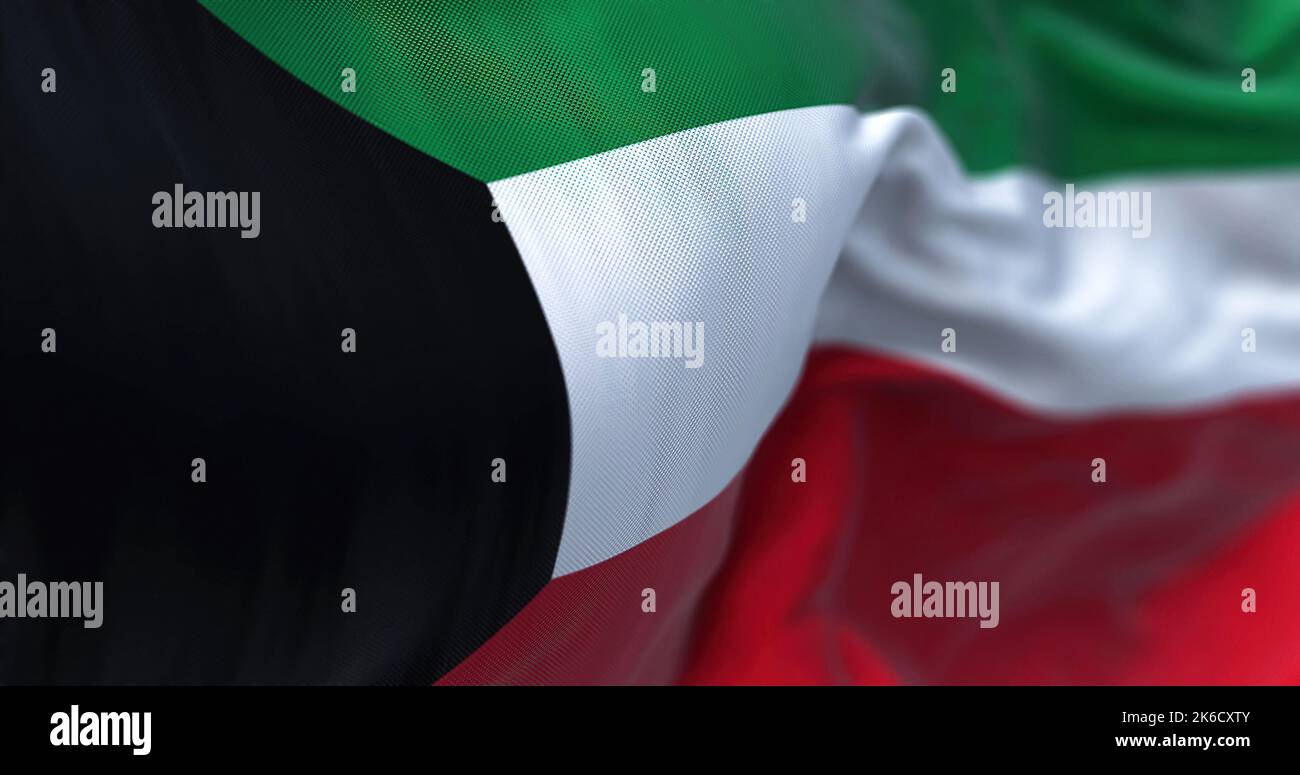 Close-up view of the Kuwait national flag waving in the wind. The State ...