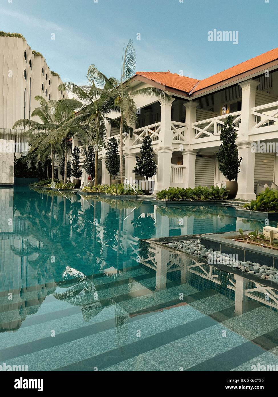 Vertical view of luxury hotel with pool side at the guest doorstep ...