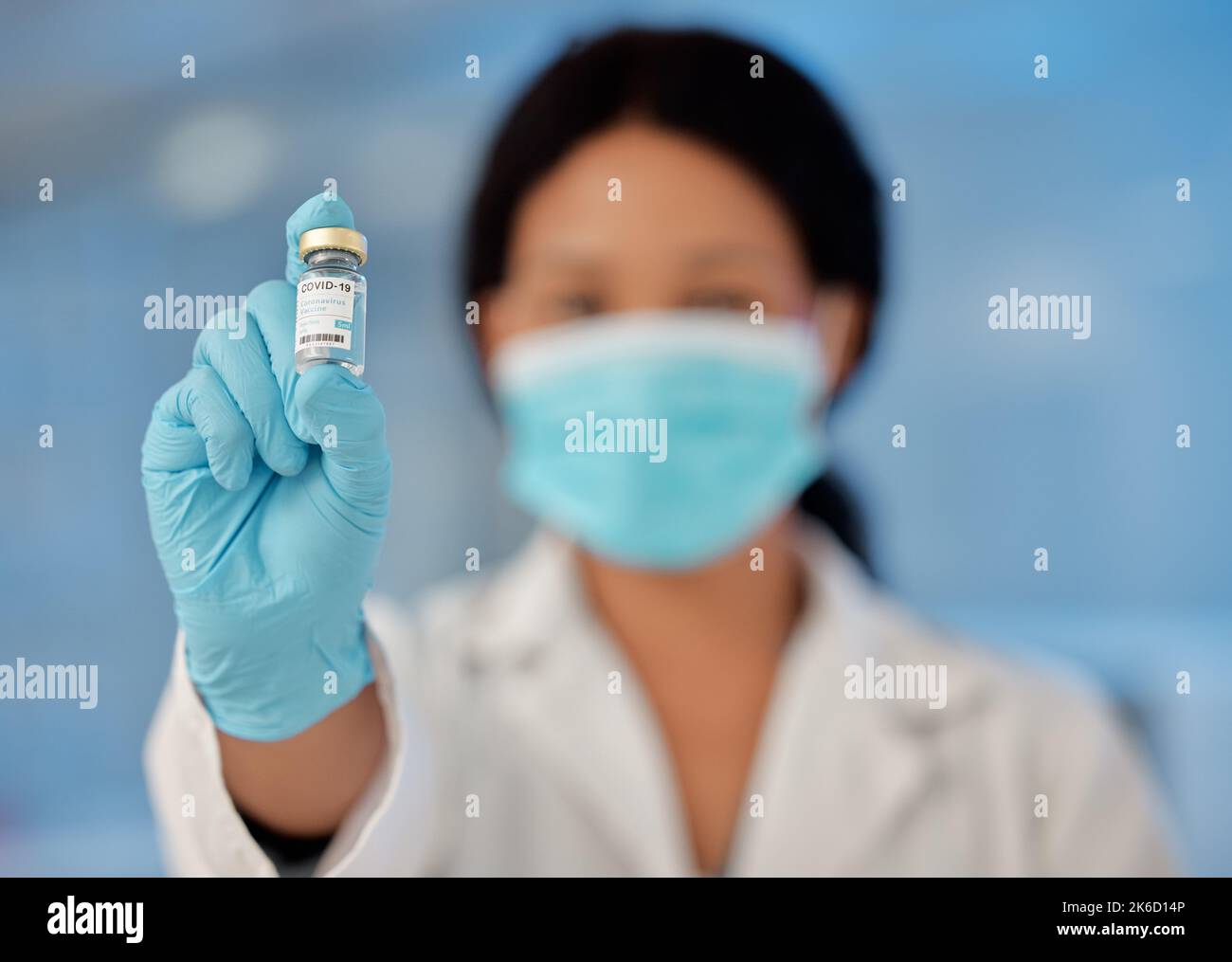 Give yourself the gift of protection. a young female lab worker holding ...
