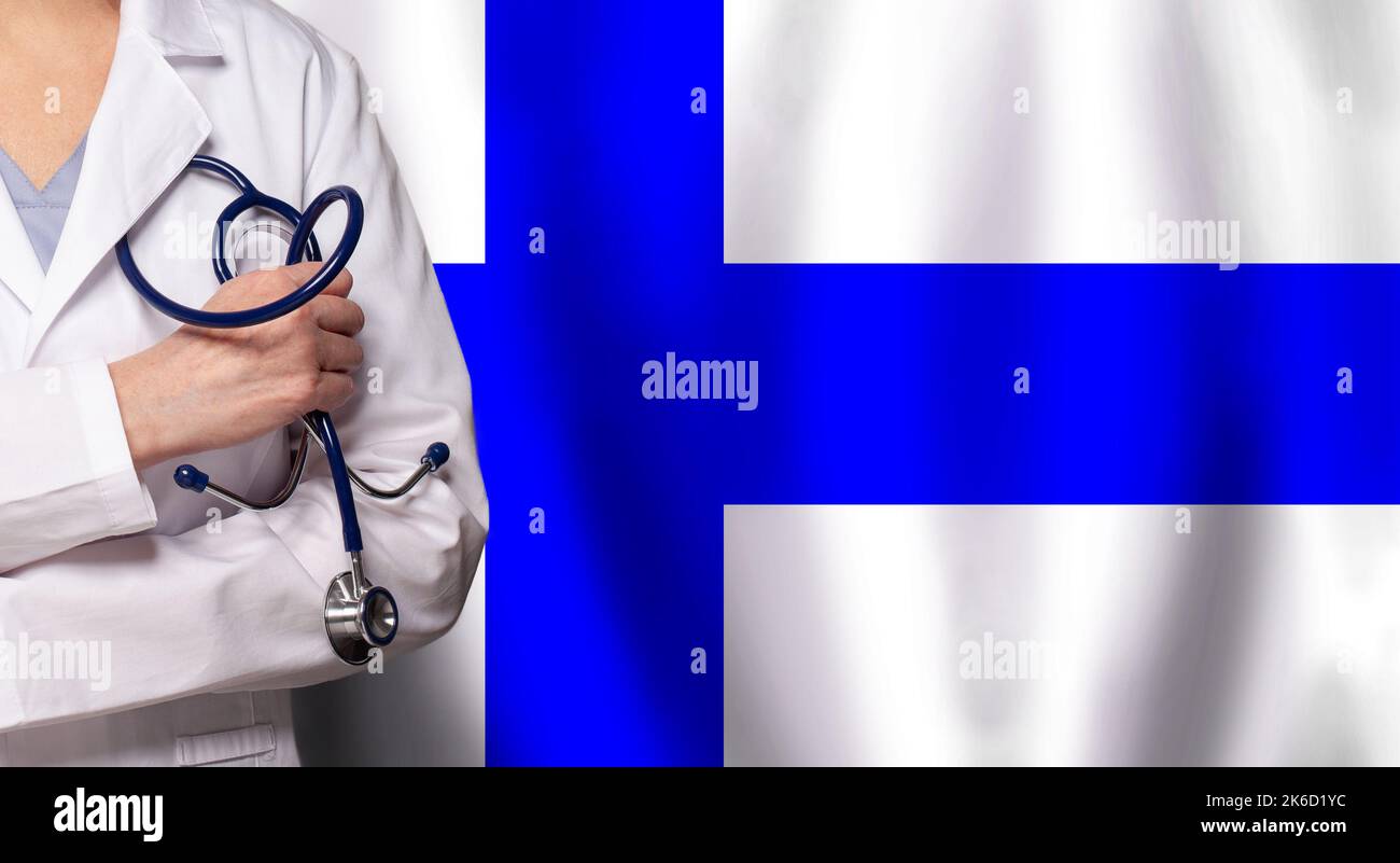 Finnish medicine and healthcare concept. Doctor close up against flag ...