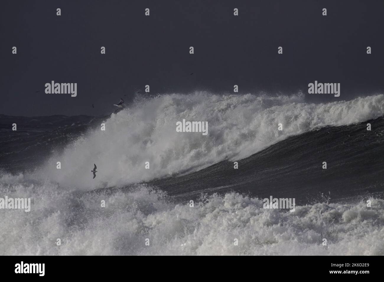 Stormy breaking waves against dark sky Stock Photo - Alamy