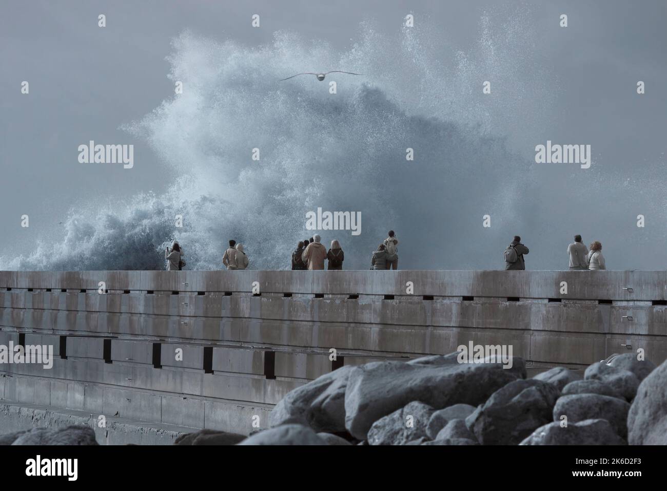 Porto, Portugal - December 31, 2015: People watching storm in the Douro ...