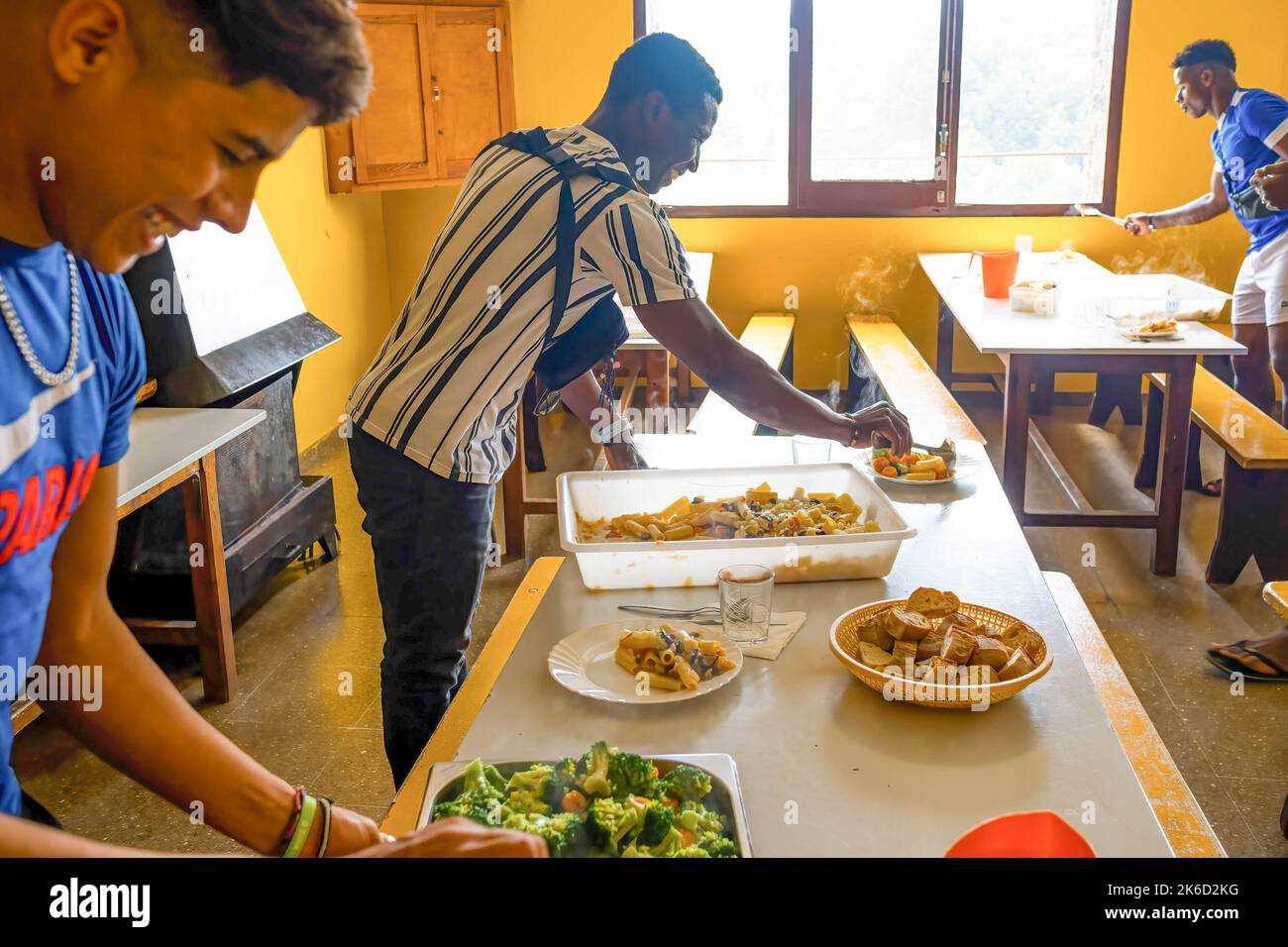 Members of the soccer team prepare for lunch during a 3 day campus in ...