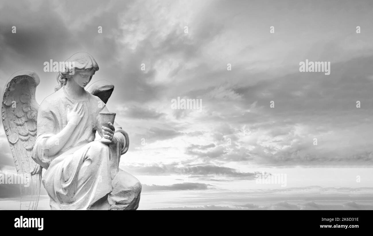 White stone guardian winged angel on sky background Stock Photo - Alamy