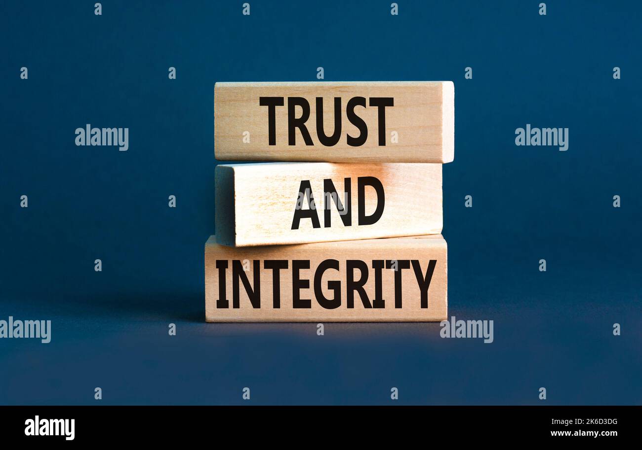 Trust and integrity symbol. Concept words Trust and integrity on wooden ...