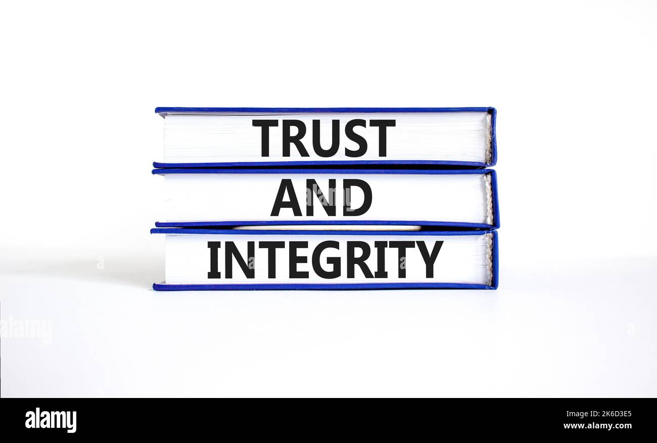 Trust and integrity symbol. Concept words Trust and integrity on books ...