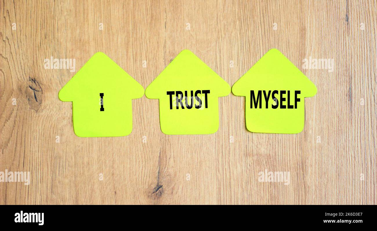 I trust myself symbol. Concept words I trust myself on papers on wooden ...