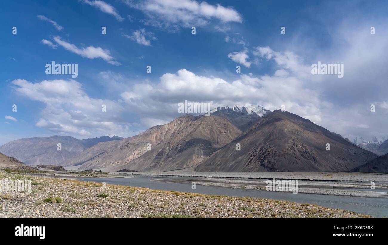 View of Hindu Kush snow-capped peaks on the Afghan side of Panj river ...